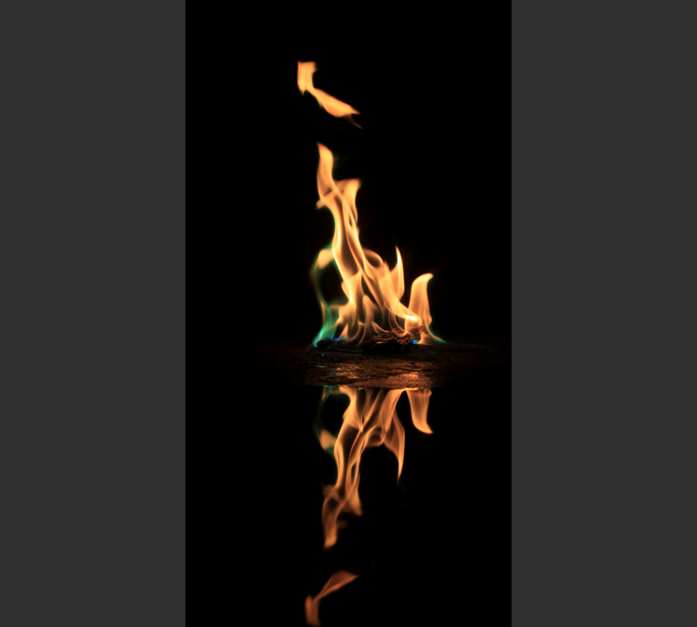 Cupric chloride emits blue and green light when burned, here seen on ...