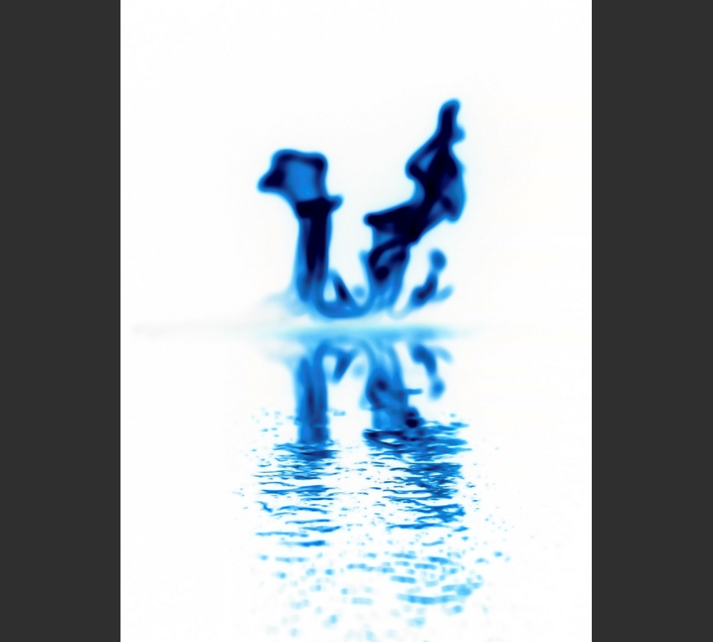 An alcohol flame, reflected in a pool of water, color reversed. - Flow ...