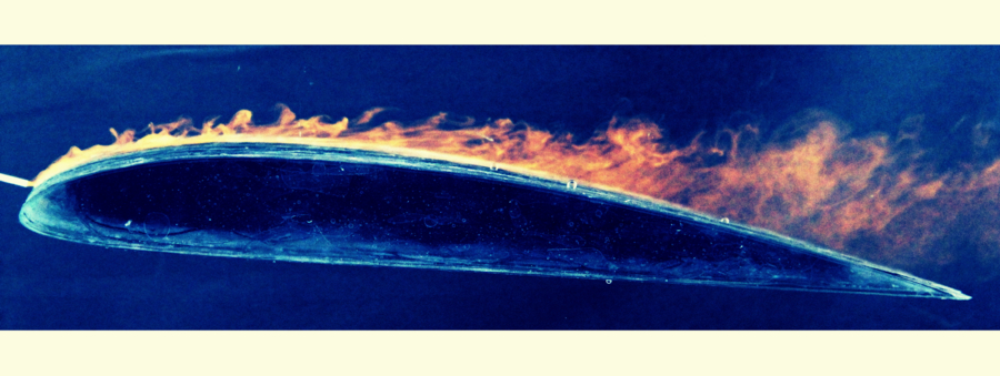Dyed water flows over a model airfoil in a flume. - Flow Visualization