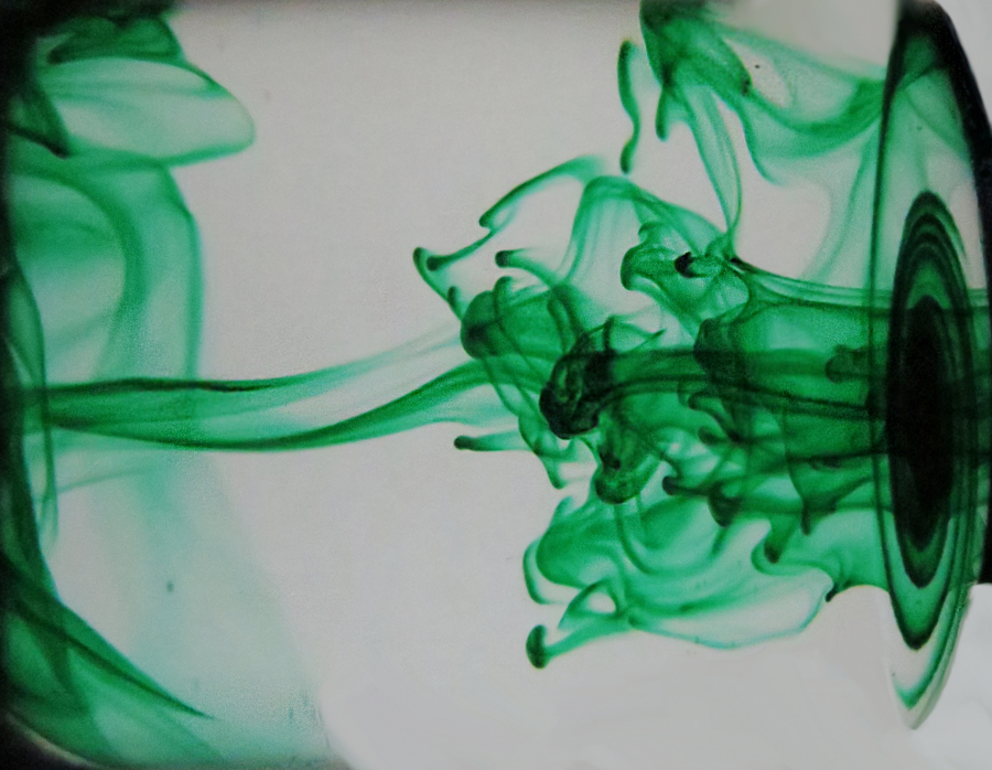 Food dye falling through gently swirling water displays complex ...
