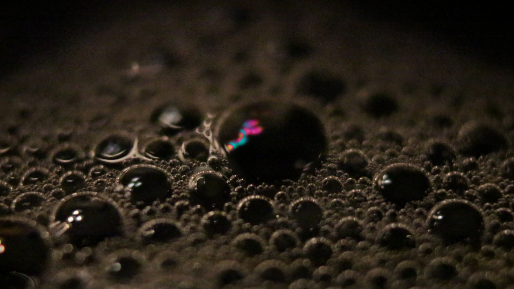 Macro image of soap bubbles reveals bubble interaction and thin film ...