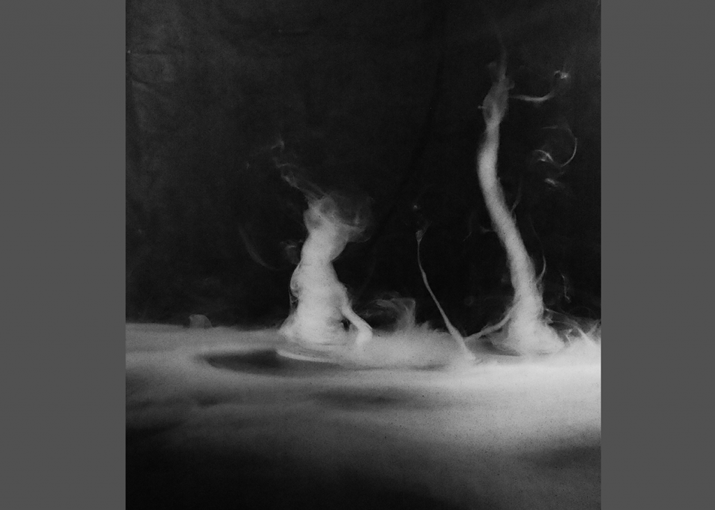 Vapor Vortex: Stage fog on a table is pulled up into vortex cores ...