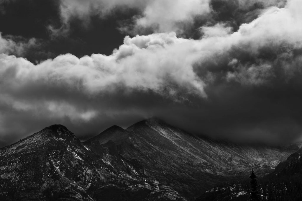 Sierra Castillo, Clouds First: Cumulus clouds hanging on mountain in a ...