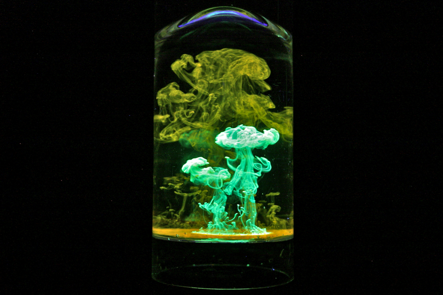 An upside-down image of green and highlighter dropped into water, showing the Rayleigh-Taylor ...
