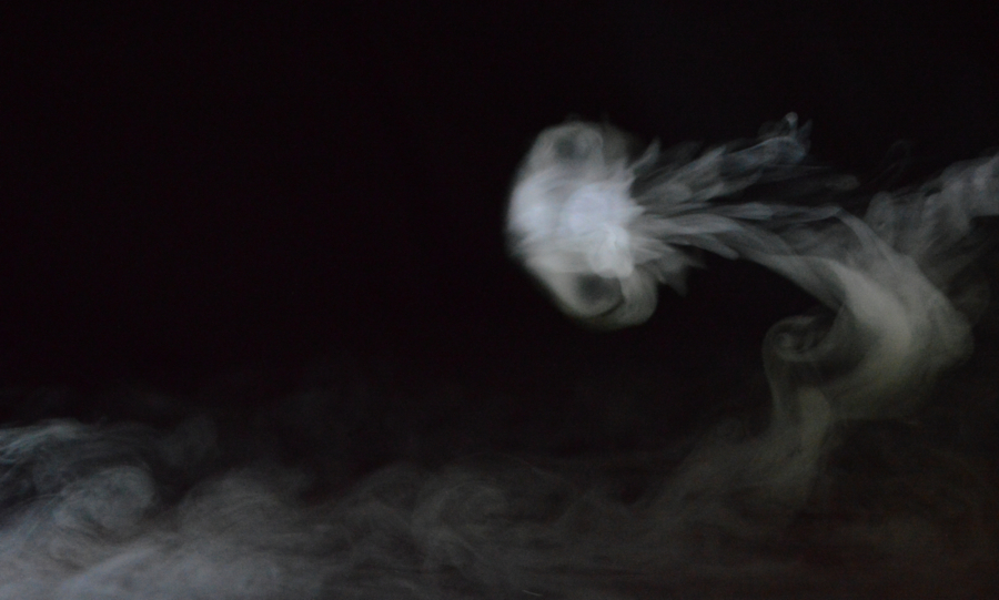 Fog associated with dry ice forms a fast-moving vortex ring when puffed ...
