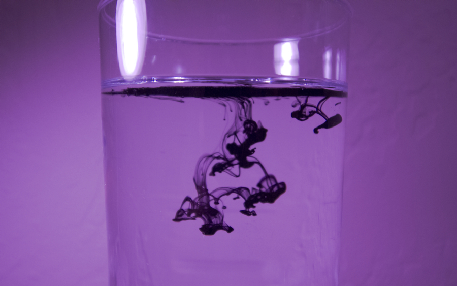 Black ink falling through water shows the Rayleigh Taylor 'umbrella ...