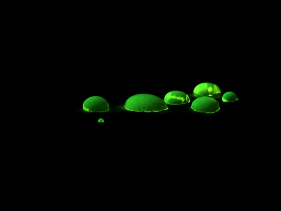 Fluorescent highlighter ink beads up on wood treated with a ...