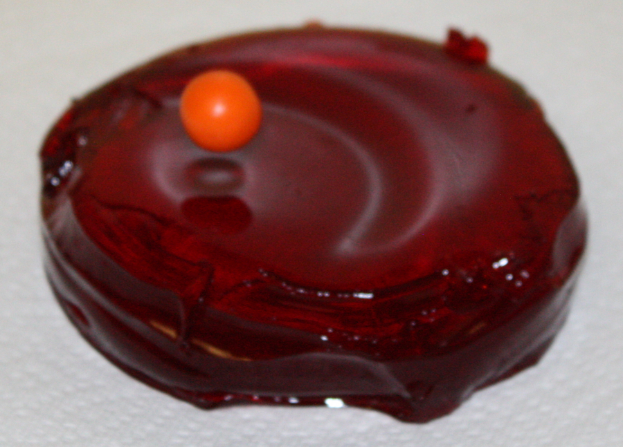 An M&M dropped onto Jell-O creates a shock wave that propagates across ...