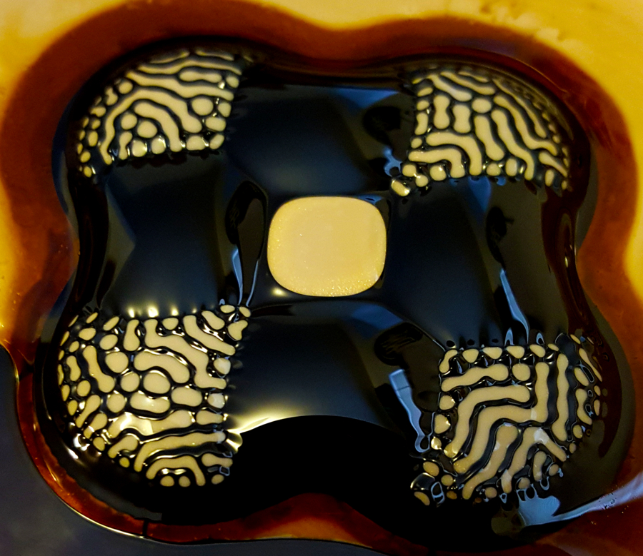 Gold acrylic paint disrupts the normal field instability generated in ferrofluid above four disc ...